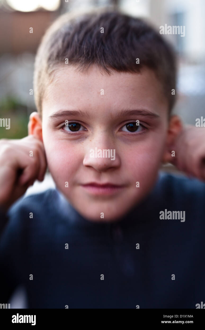 Little Boy making faces and being silly outside of his house Stock ...