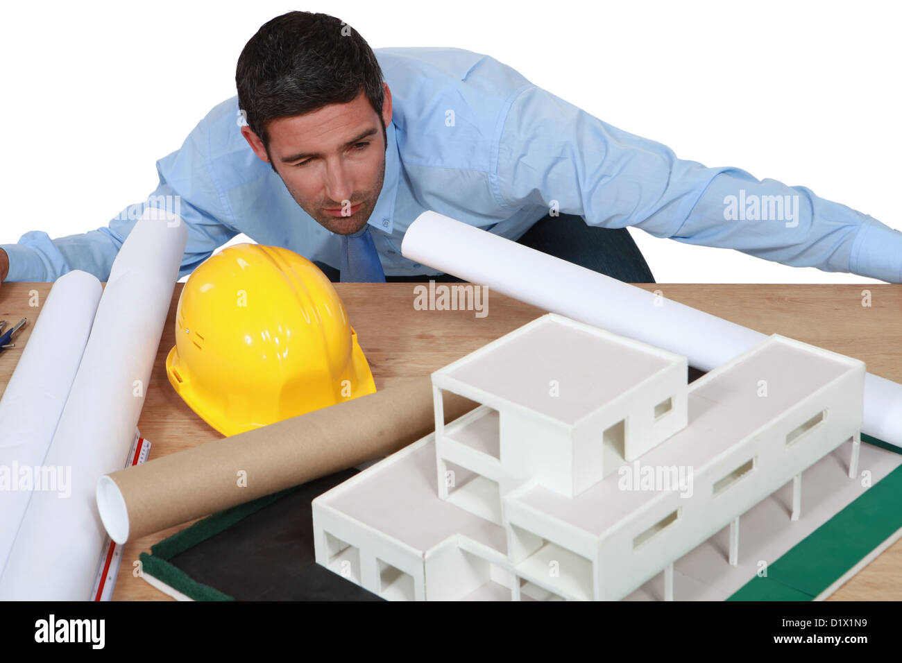 Engineer peering through a tube Stock Photo - Alamy Engineer peering through a tube Stock Photo - Alamy