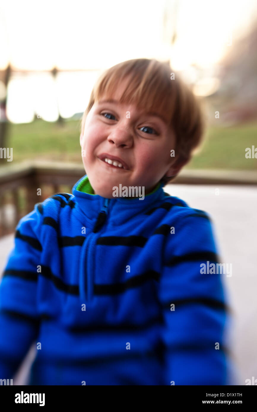 Little Boy making faces and being silly outside of his house Stock ...