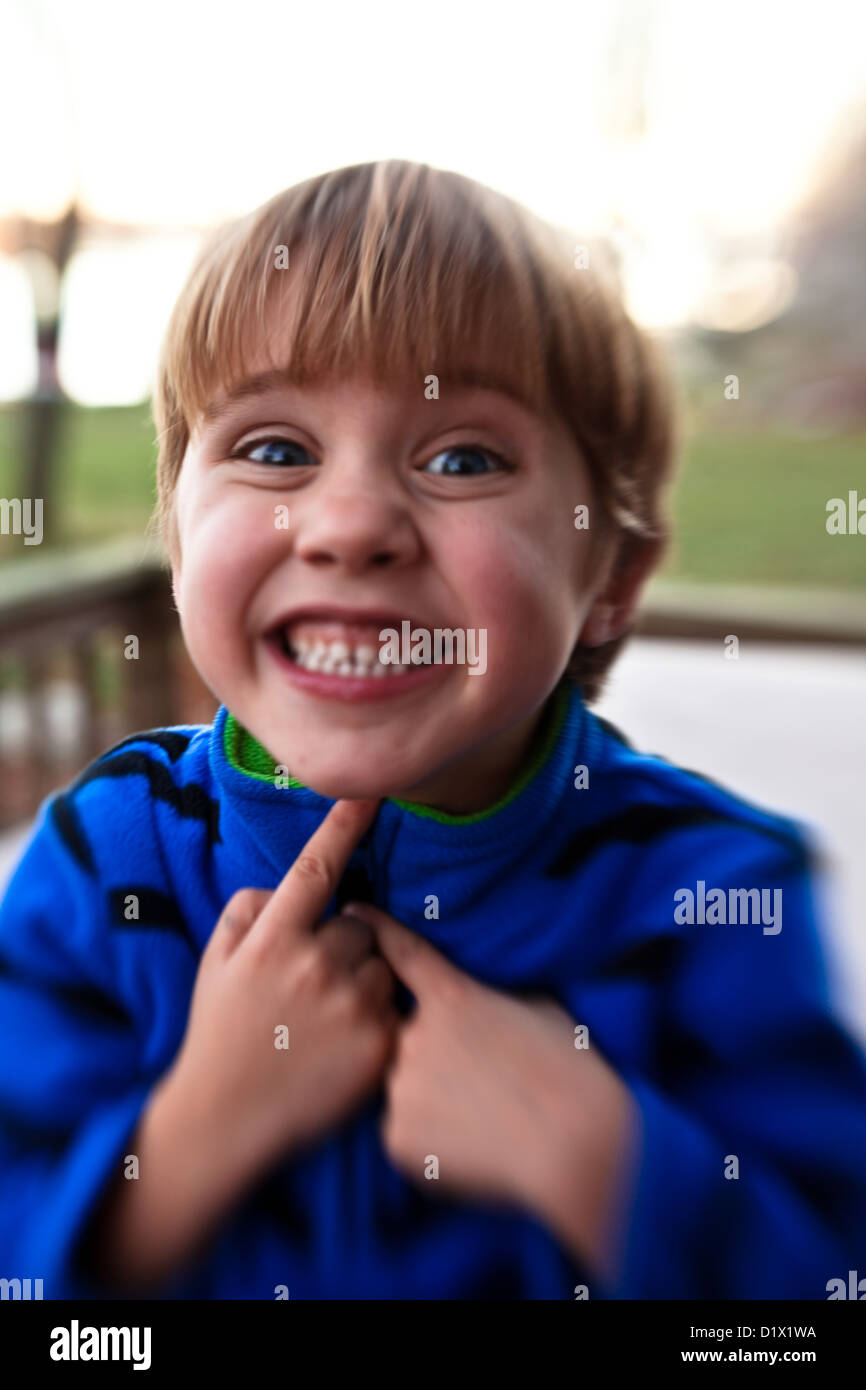 Little Boy making faces and being silly outside of his house Stock ...