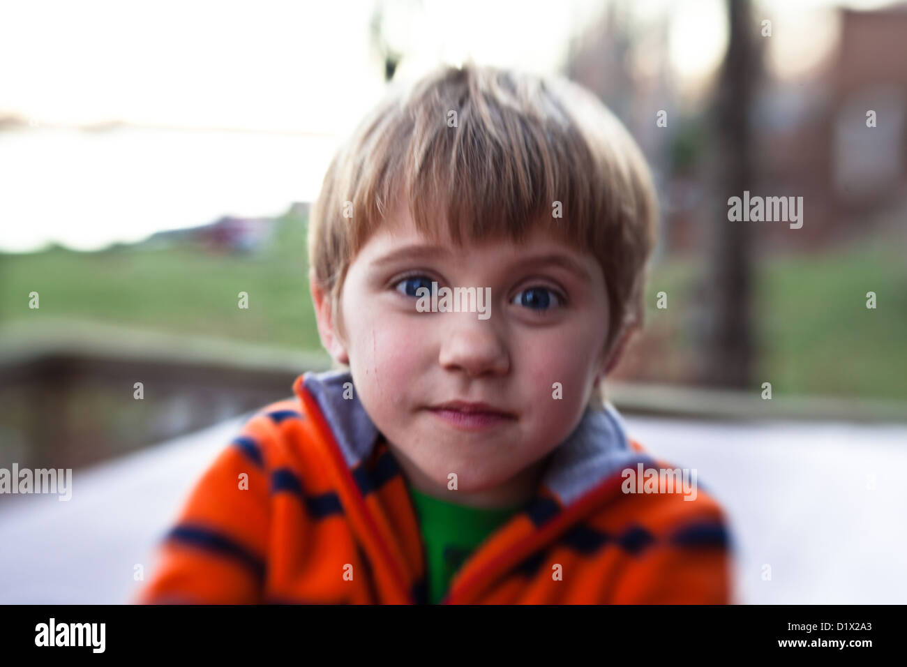 Little Boy making faces and being silly outside of his house Stock ...