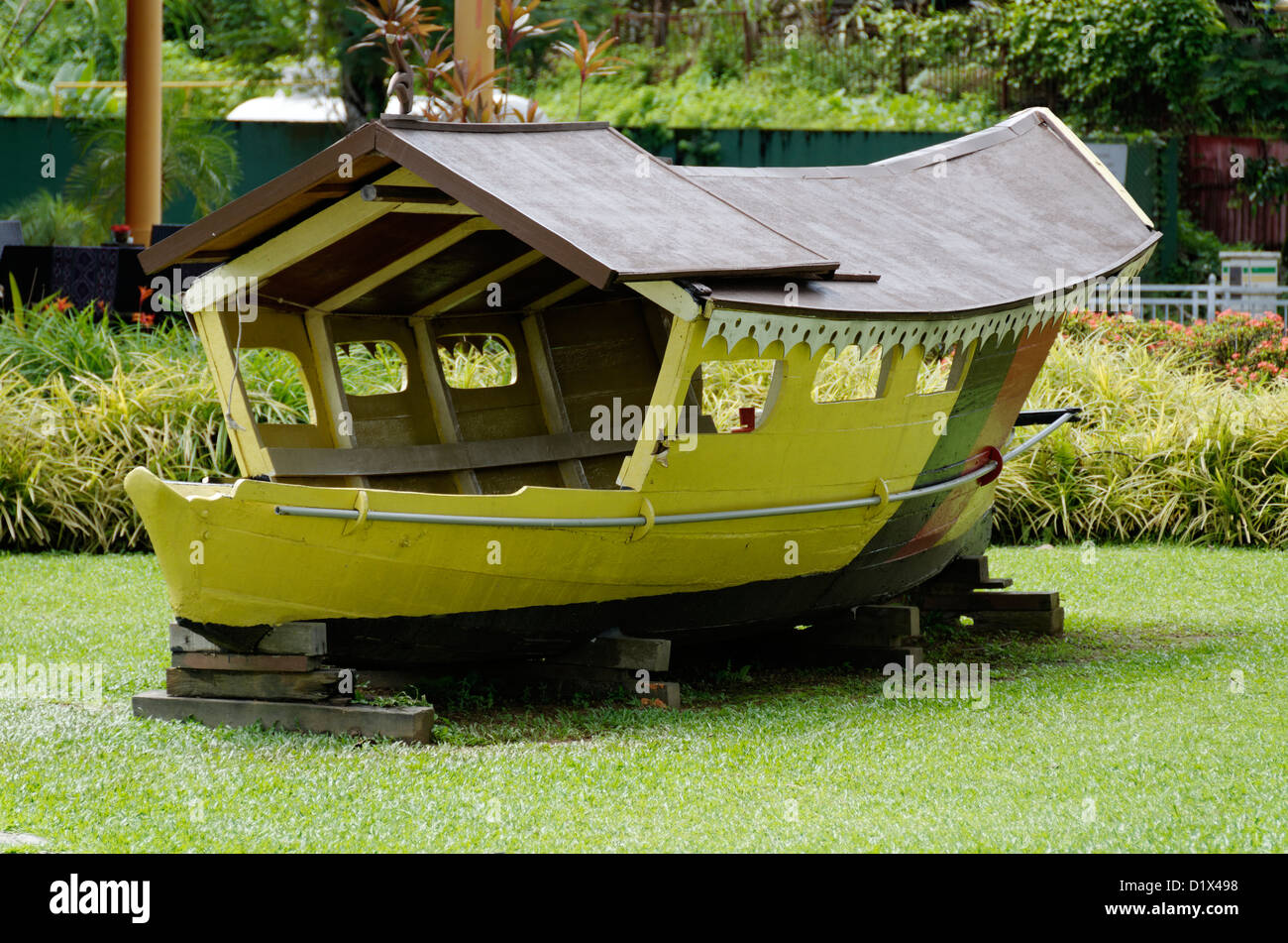 Sampan water ferry exhibited on a lawn by Kuching Riverside. Sarawak ...