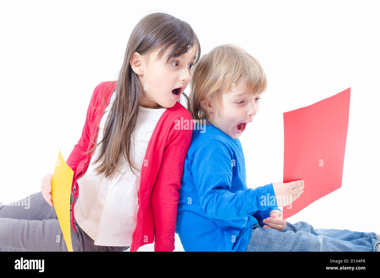 Two kids looking astonished isolated on white Stock Photo - Alamy