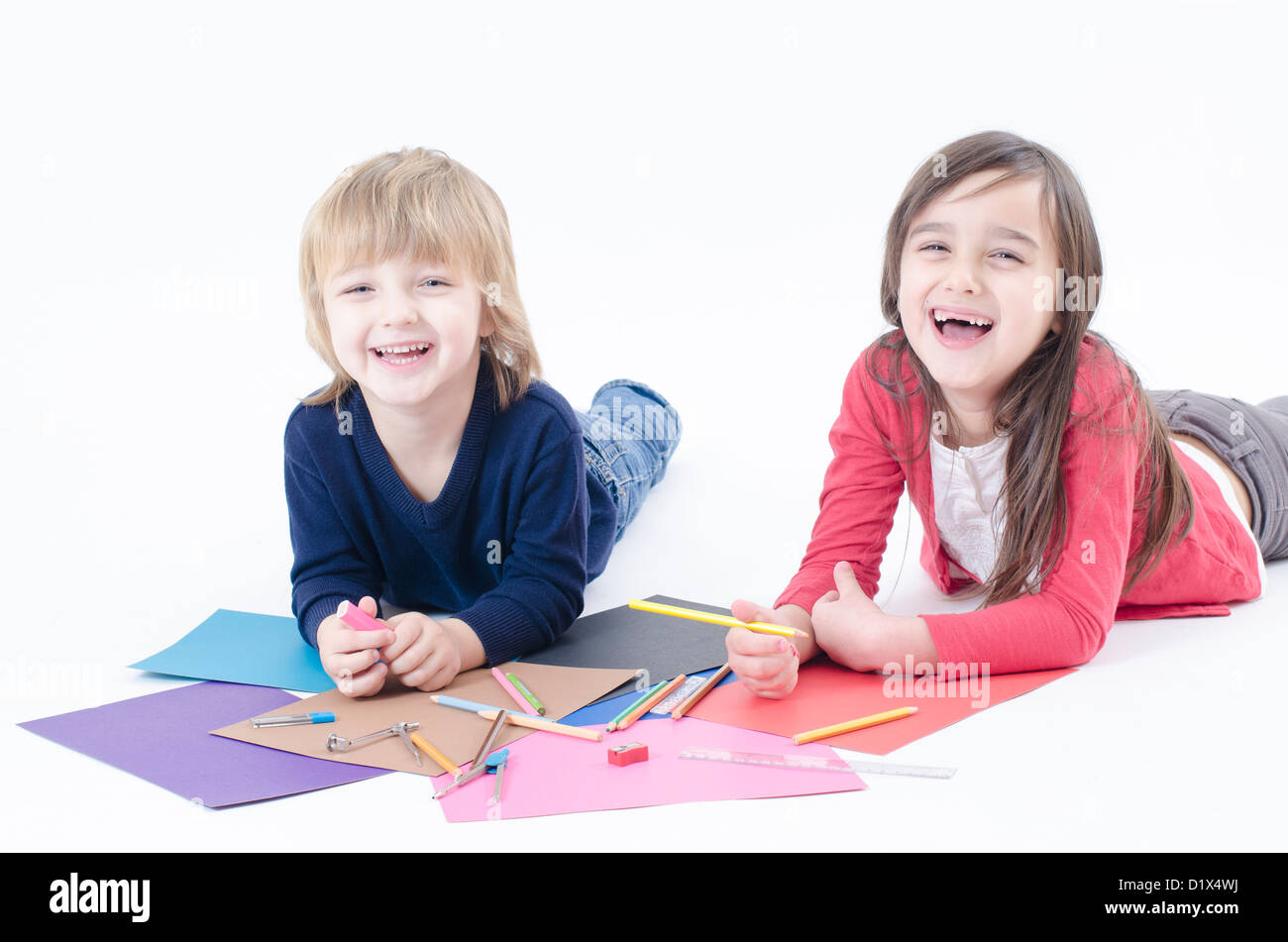 Two happy children doing homework Stock Photo - Alamy