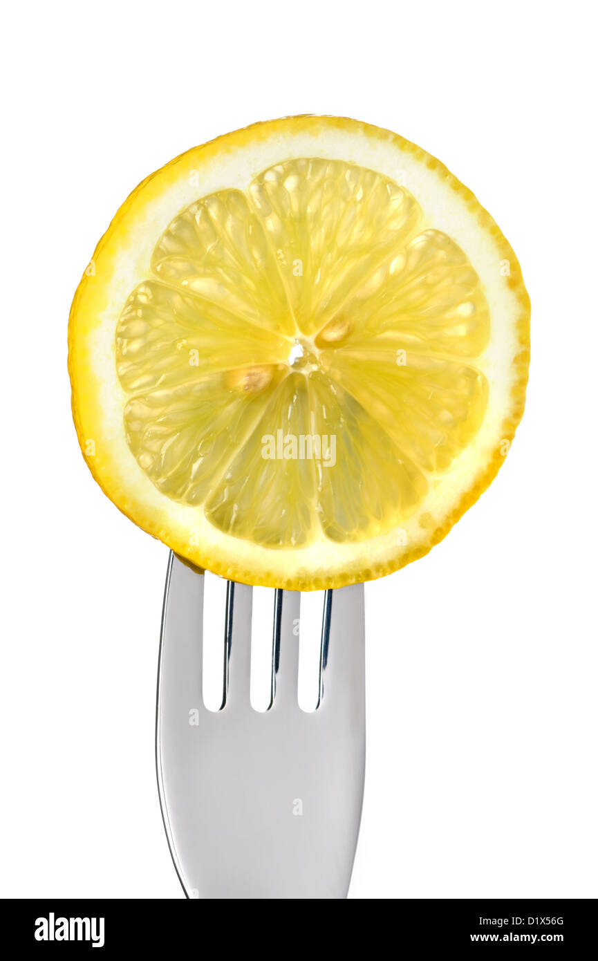 fresh lemon slice on a fork isolated against white background Stock ...