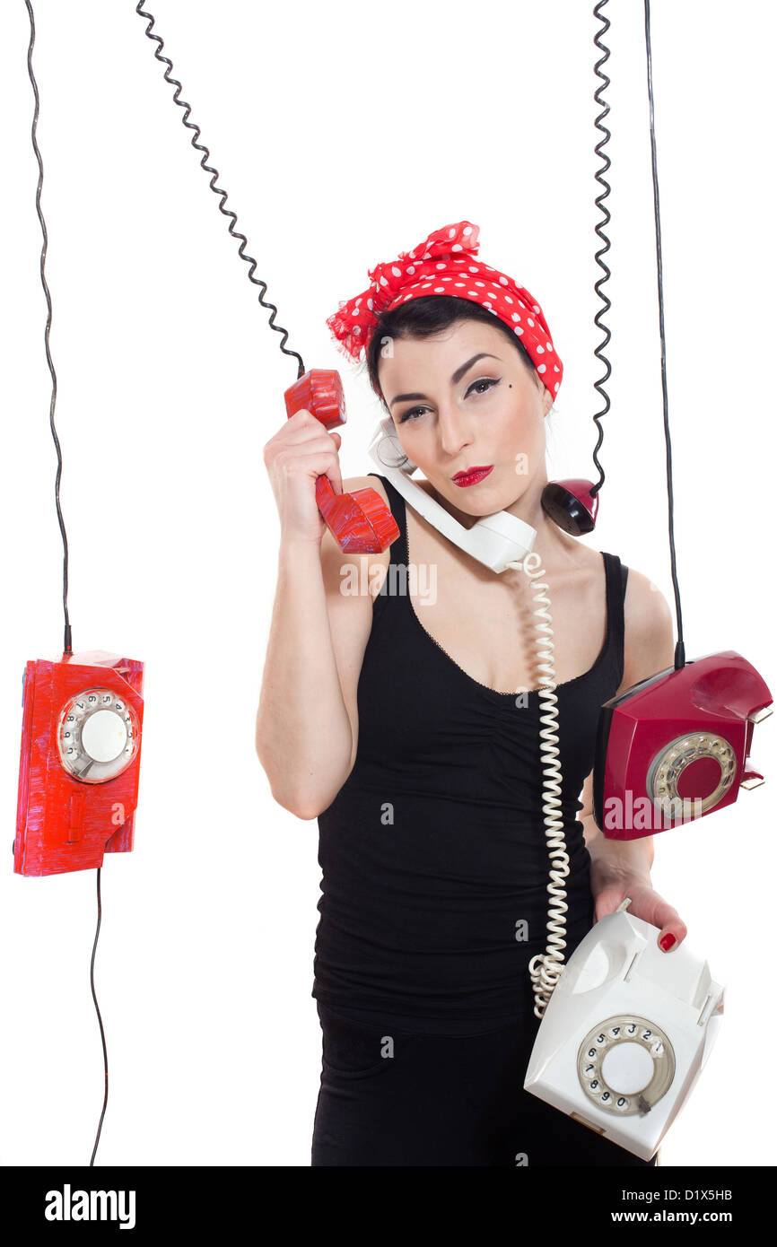 Woman with red kerchief holding many phones which are hanging Stock ...
