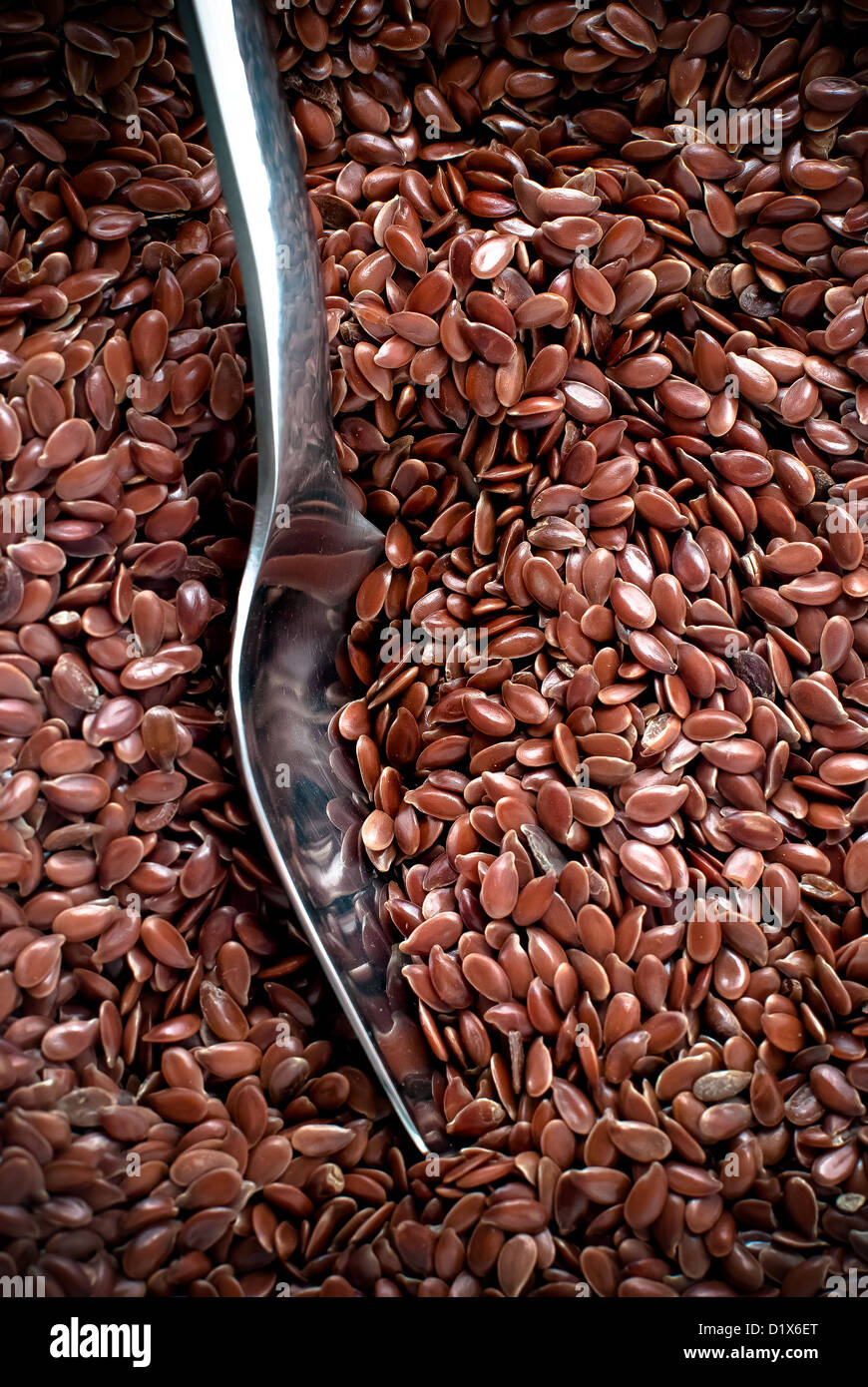 Linseed and a spoon detailed background Stock Photo - Alamy