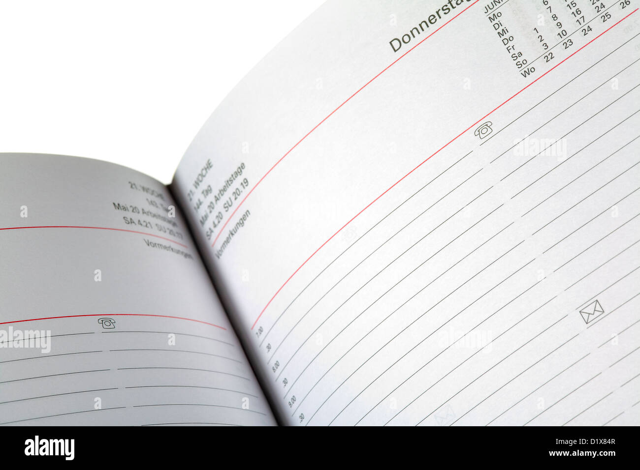 Close up of a open diary, isolated on white background Stock Photo - Alamy