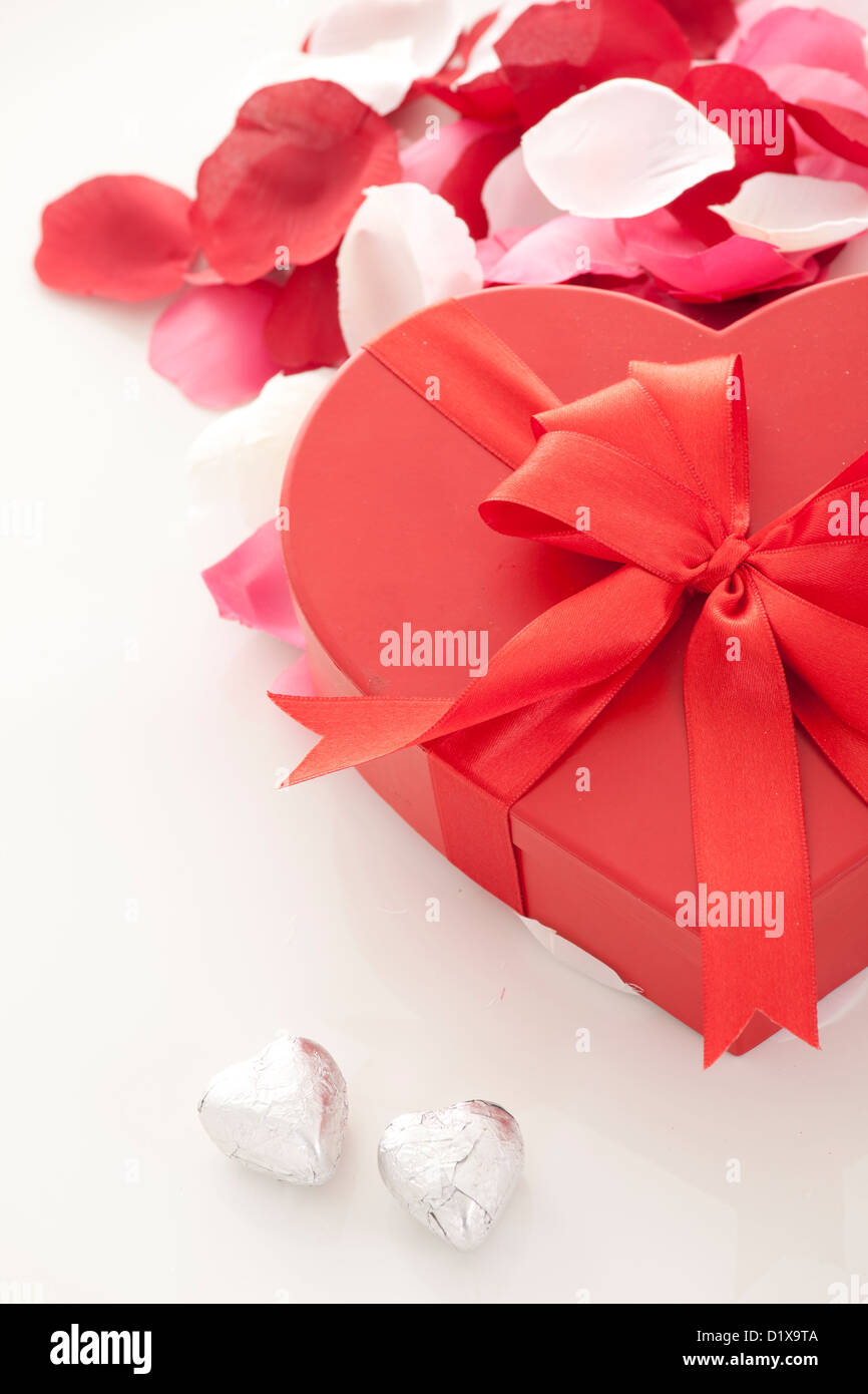 Valentines Day gift in red box with rose petal isolated on white Stock ...