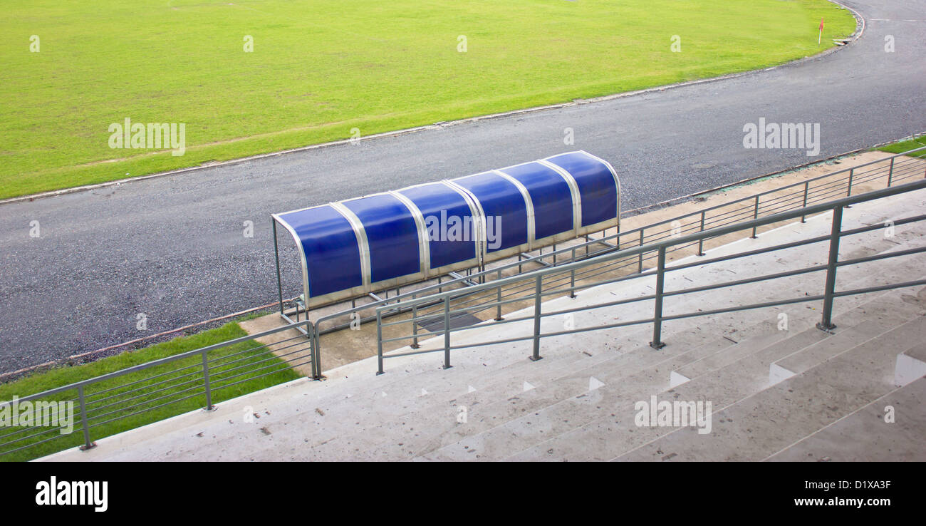 Coach and reserve benches in football stadium Stock Photo - Alamy