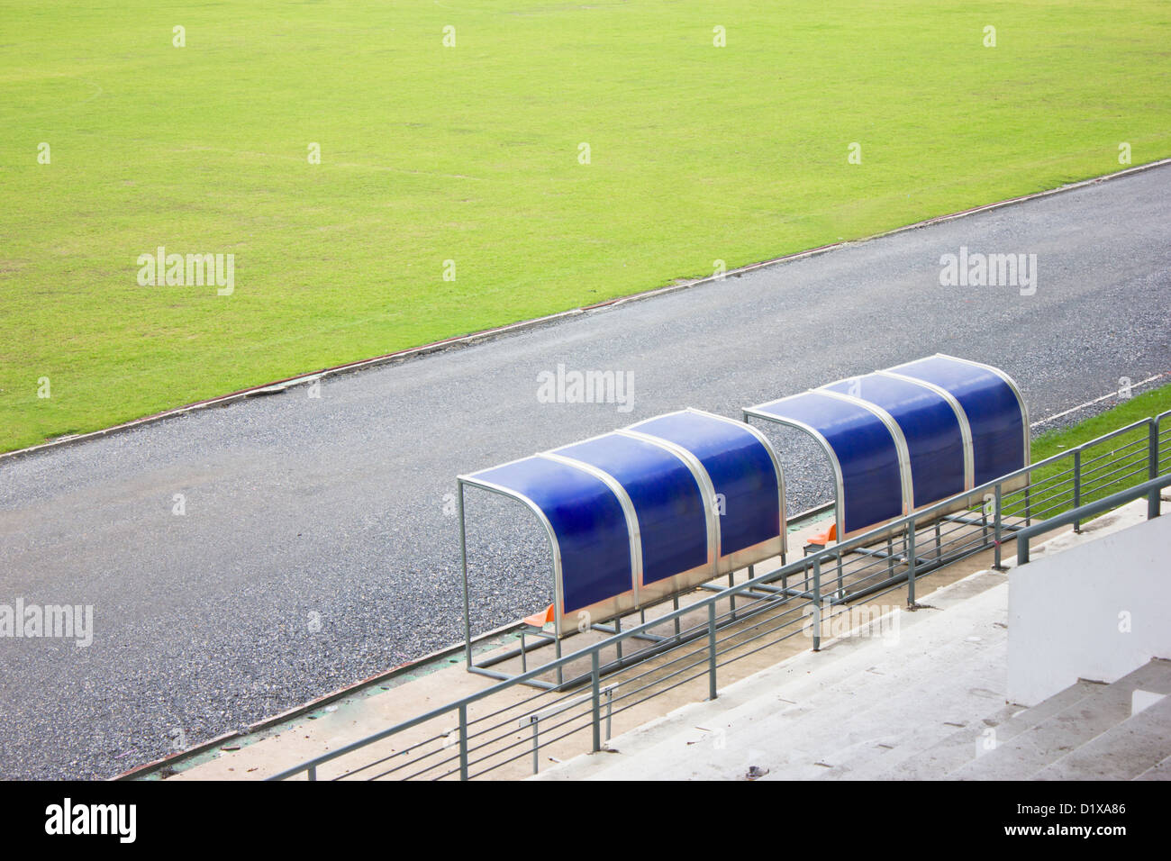 Coach and reserve benches in football stadium Stock Photo - Alamy
