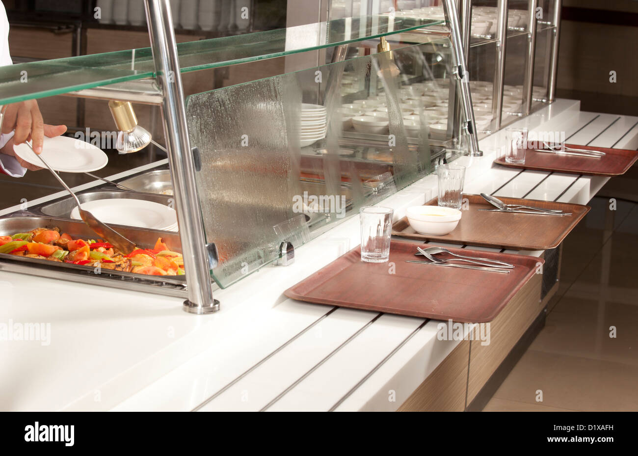 chef standing behind full lunch service station Stock Photo - Alamy
