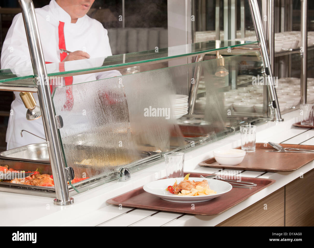 chef standing behind full lunch service station Stock Photo - Alamy