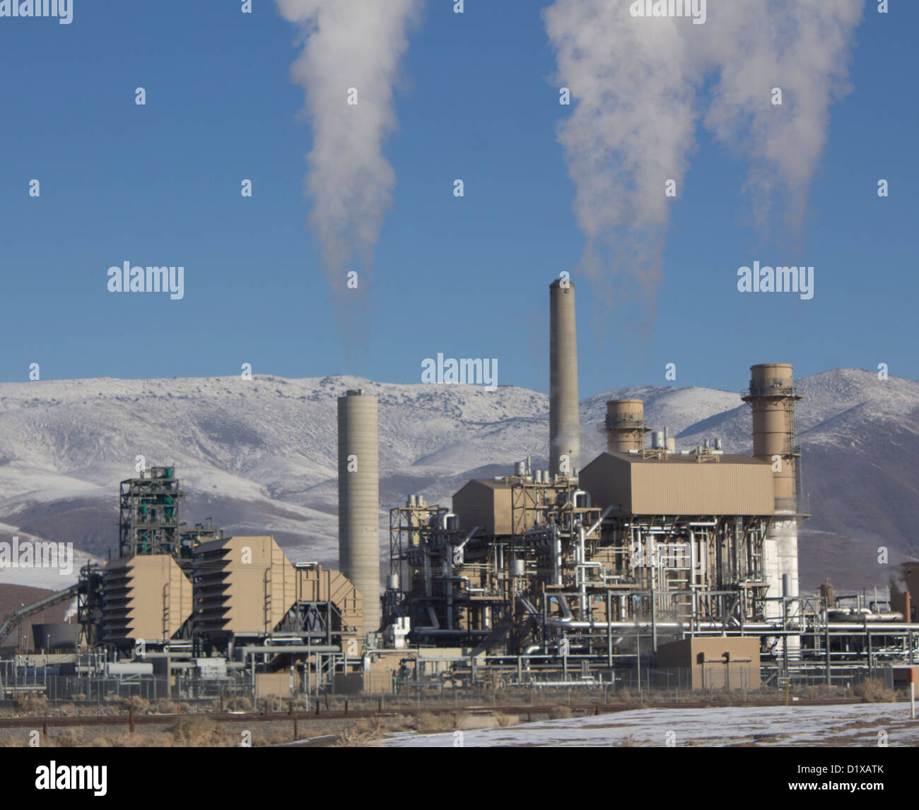 Power Plant smokestacks with blue skies and mountains Stock Photo - Alamy