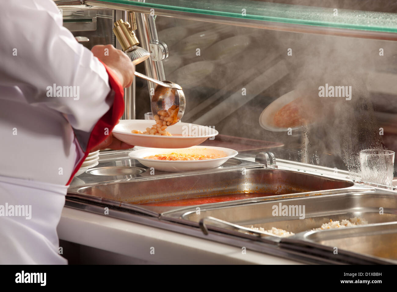 chef standing behind full lunch service station Stock Photo - Alamy