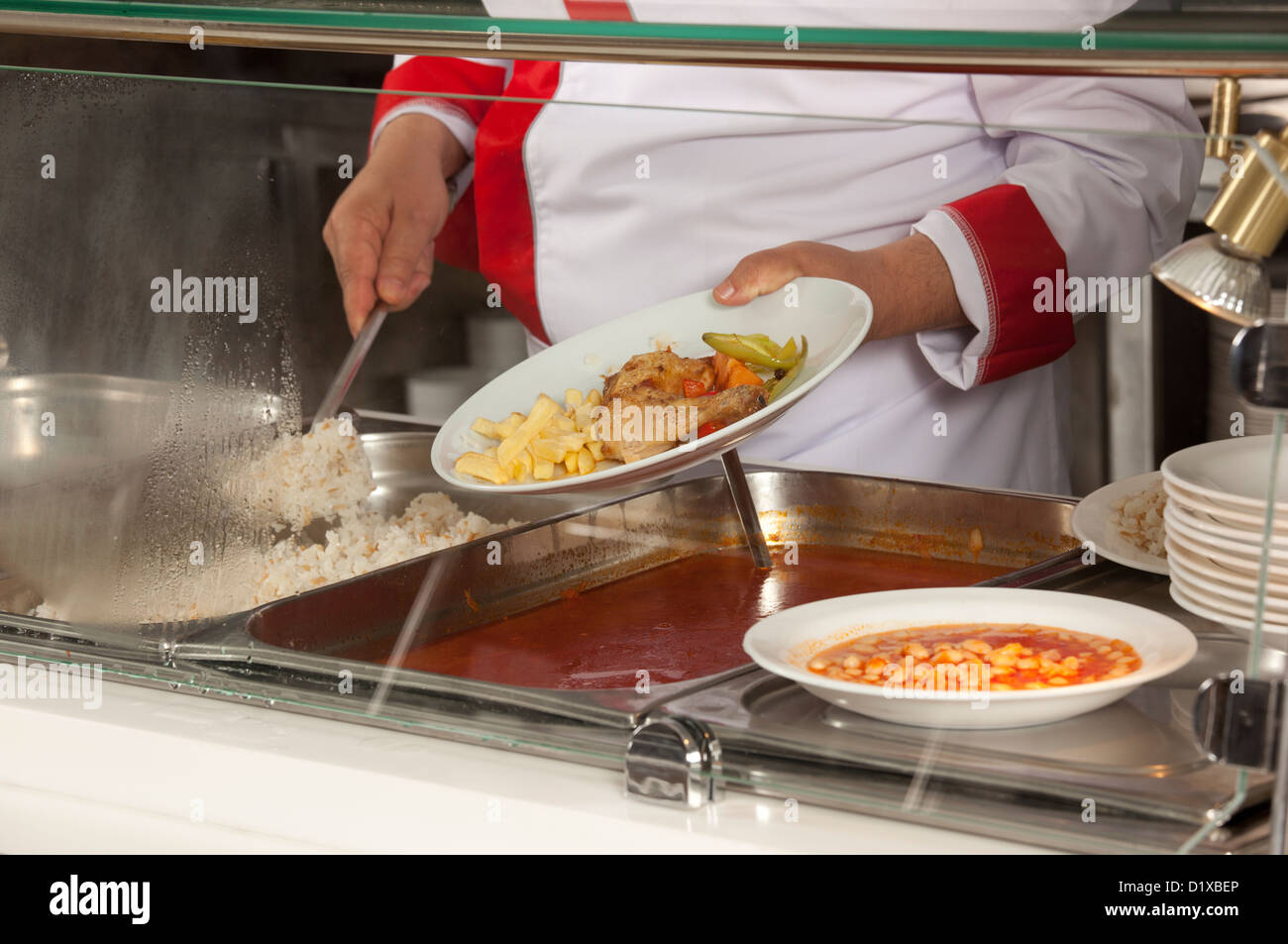 chef standing behind full lunch service station Stock Photo - Alamy