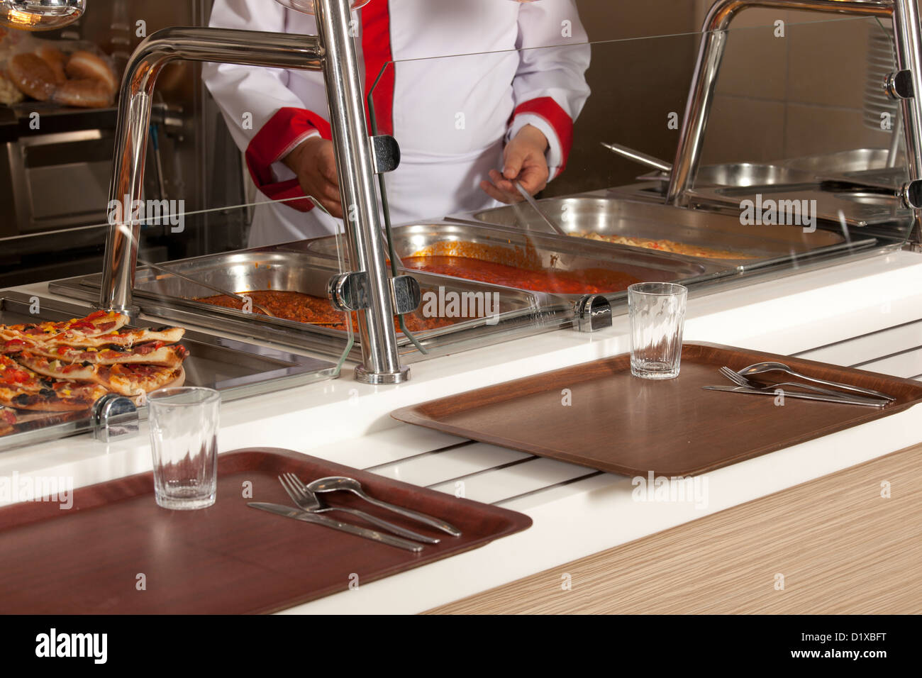 chef standing behind full lunch service station Stock Photo - Alamy