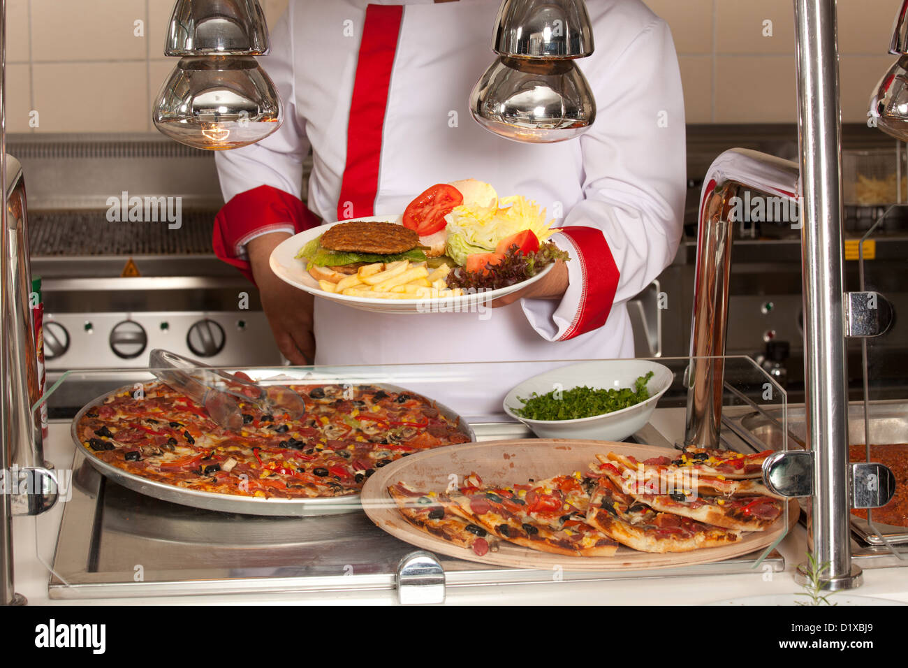 chef standing behind full lunch service station Stock Photo - Alamy