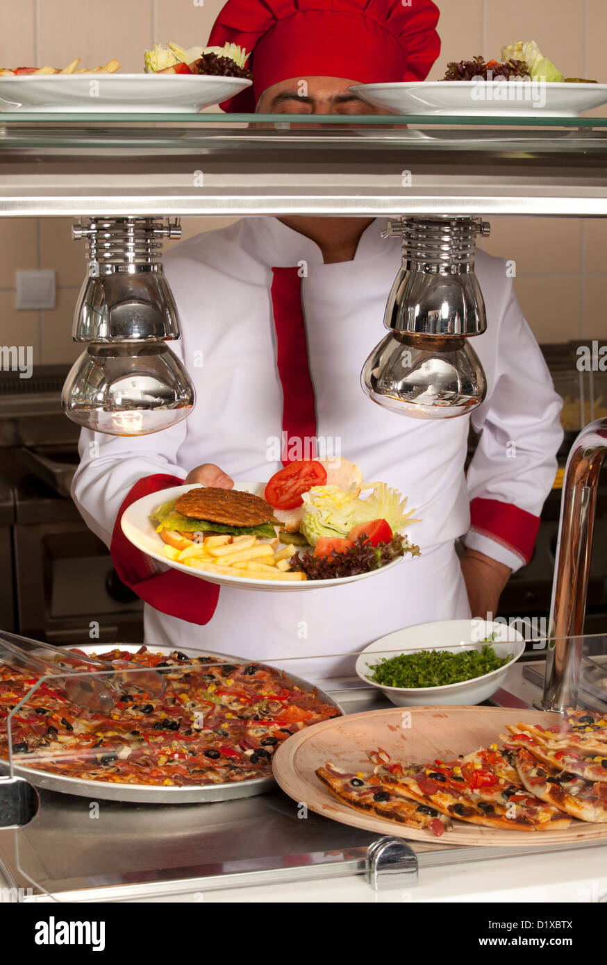chef standing behind full lunch service station Stock Photo - Alamy