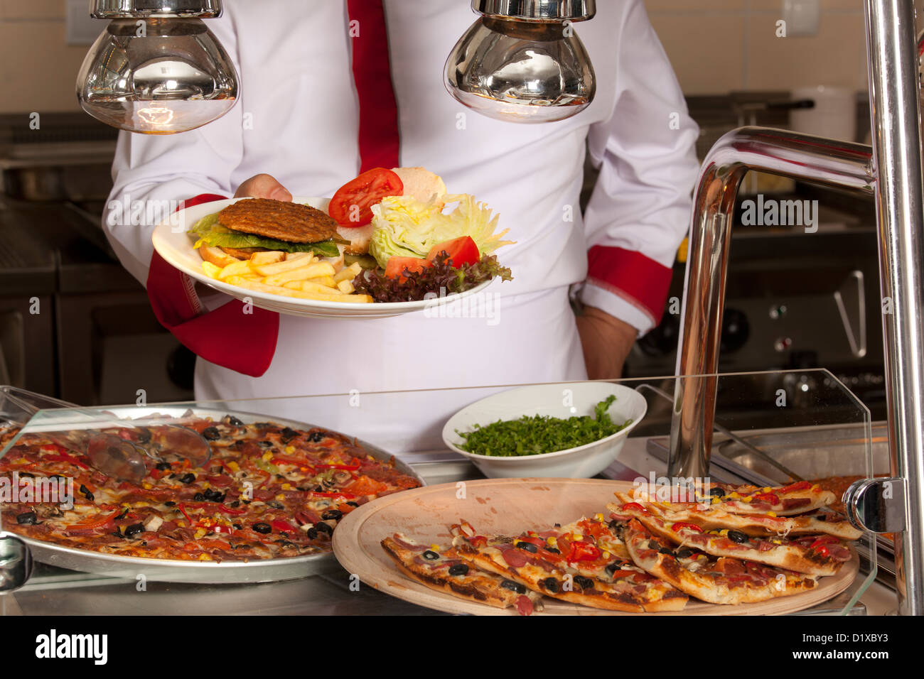 chef standing behind full lunch service station Stock Photo - Alamy