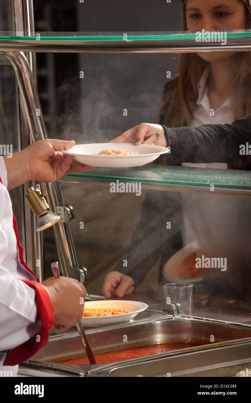 chef standing behind full lunch service station Stock Photo - Alamy