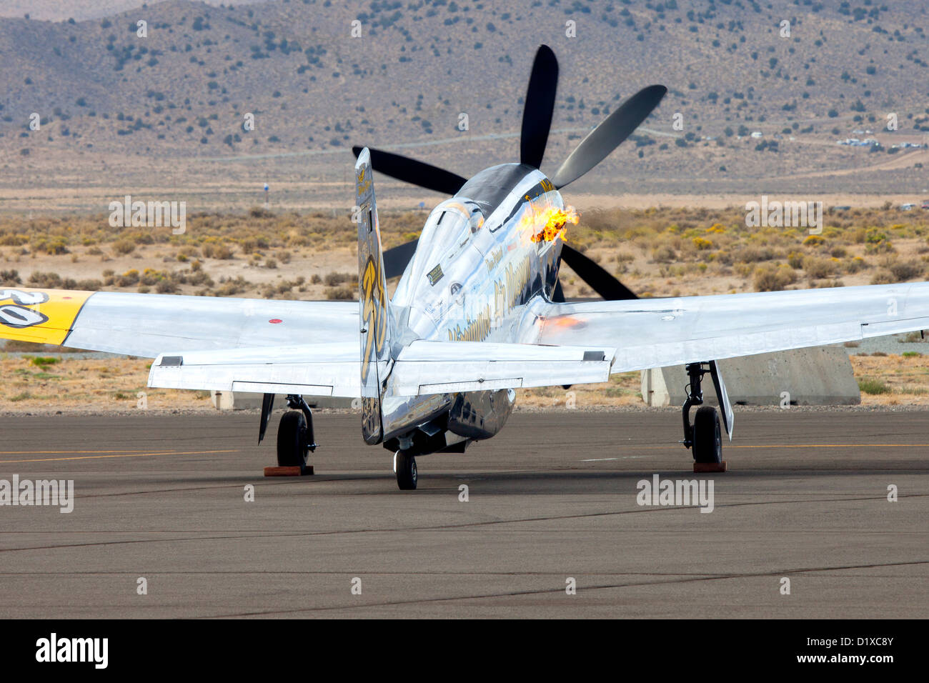 Flames belch from the exhaust stacks of the P-51 Mustang Unlimited Air ...