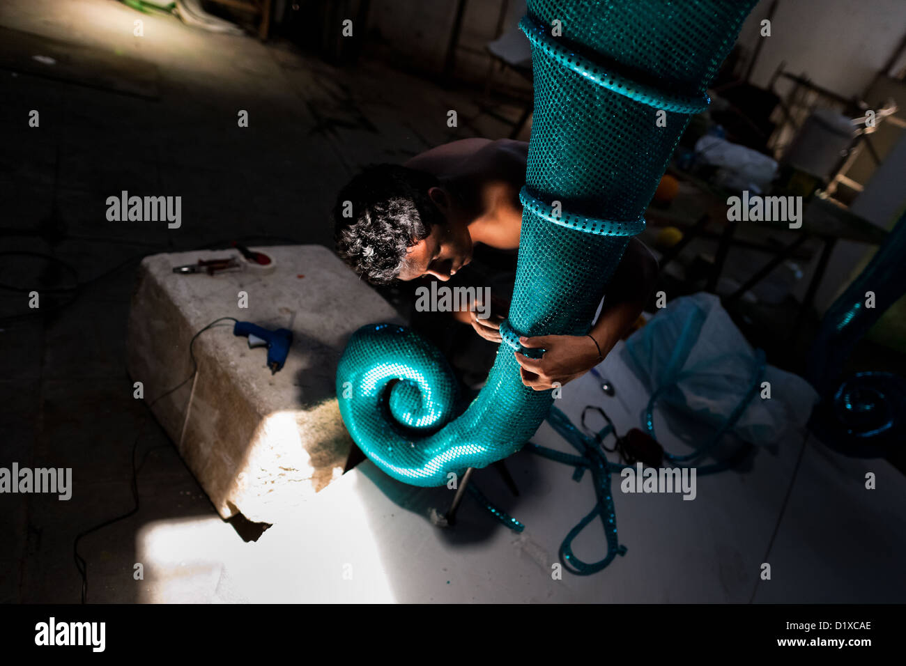 A samba school sculptor works on a carnival statue inside the workshop ...