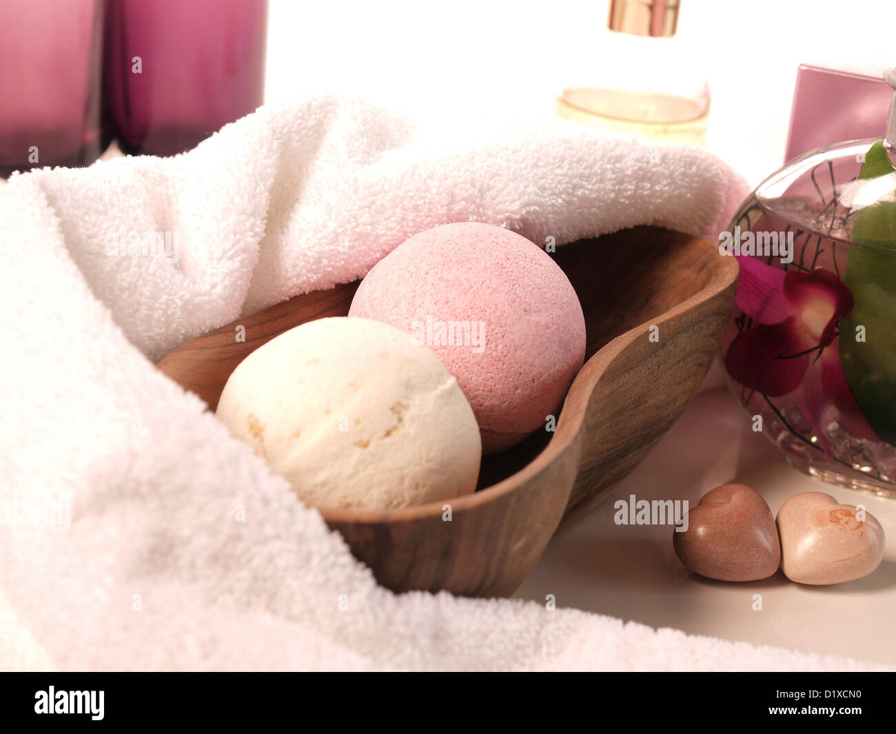Bath additive with towels and decoration Stock Photo - Alamy