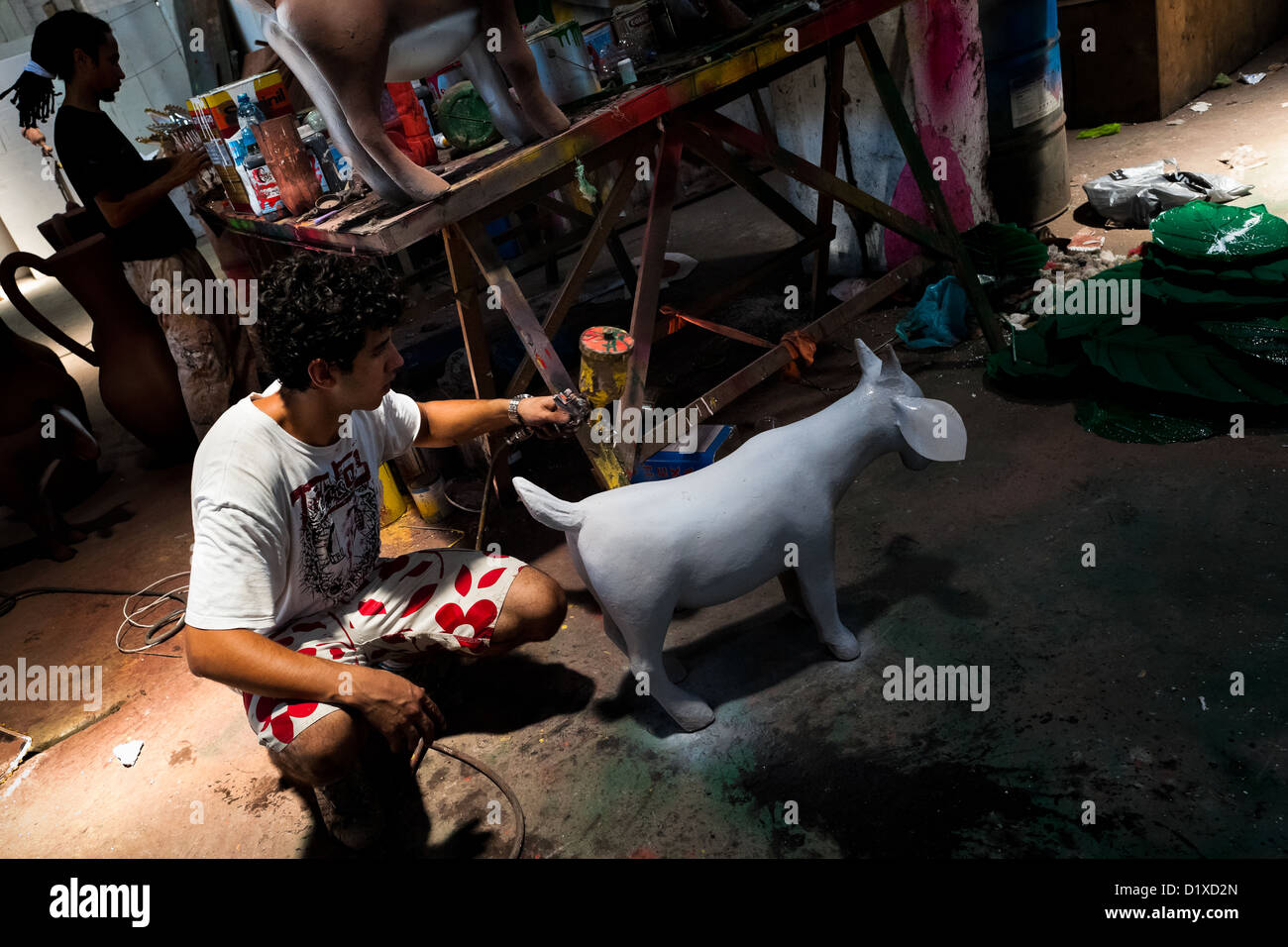 A samba school sculptor works on a carnival statue inside workshop in ...