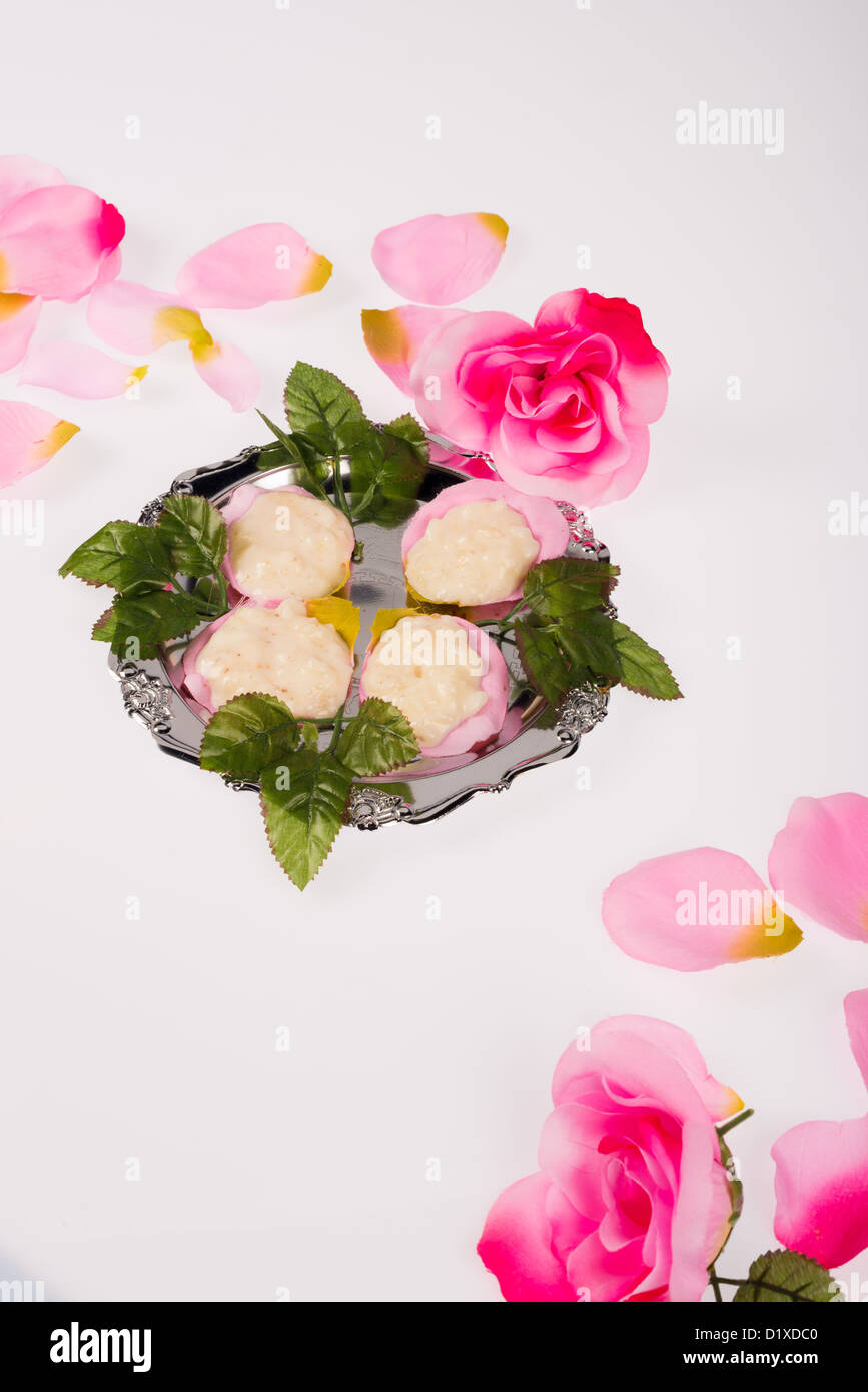 Sweet Valentine, sweets inside rose petals Stock Photo - Alamy