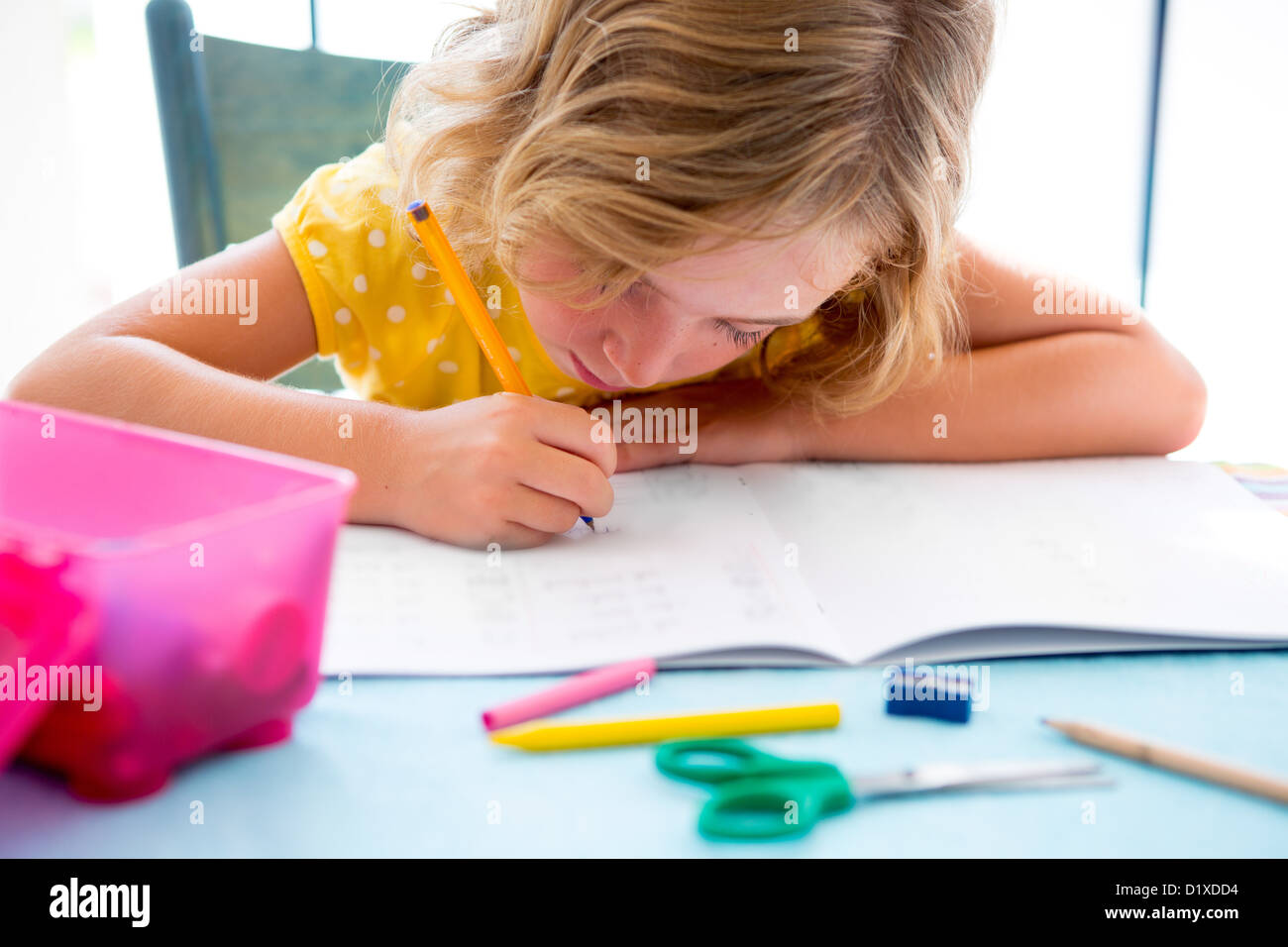 Child student kid girl writing with homework on desk table Stock Photo ...