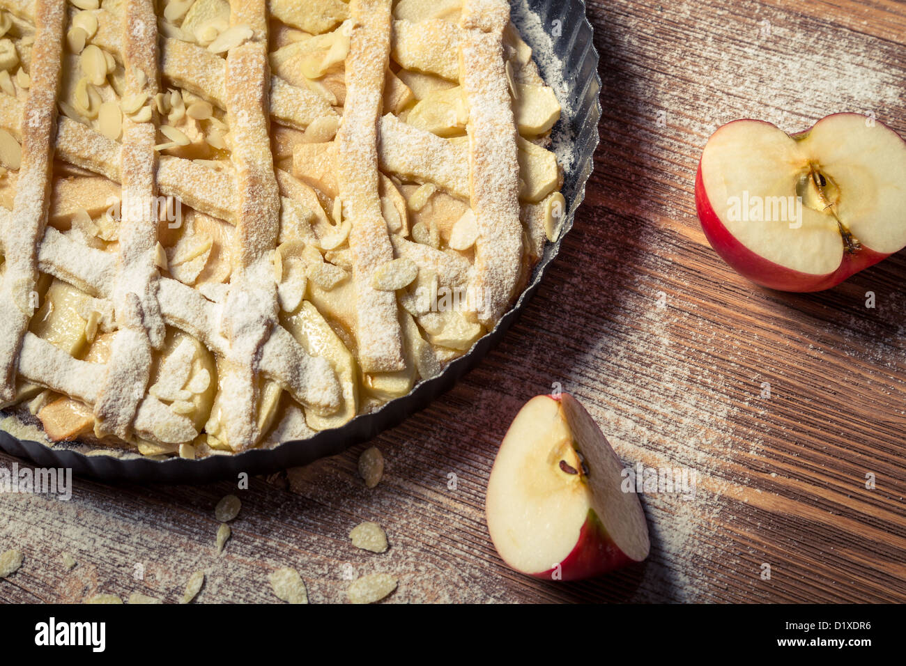 Apples and baked apple cake decorated with icing sugar Stock Photo - Alamy