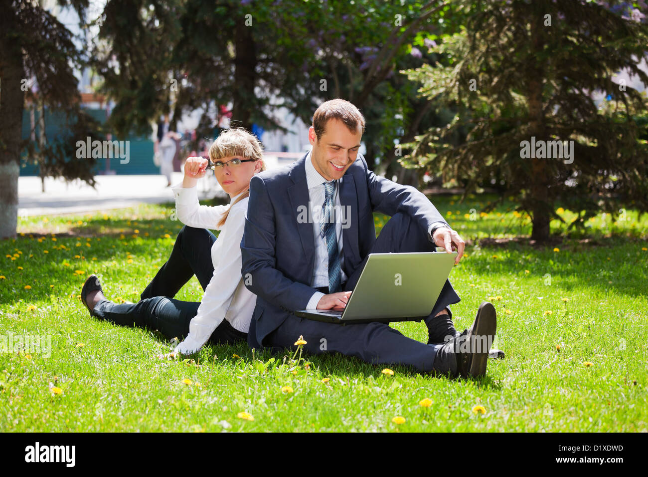 Young business people with laptop Stock Photo - Alamy