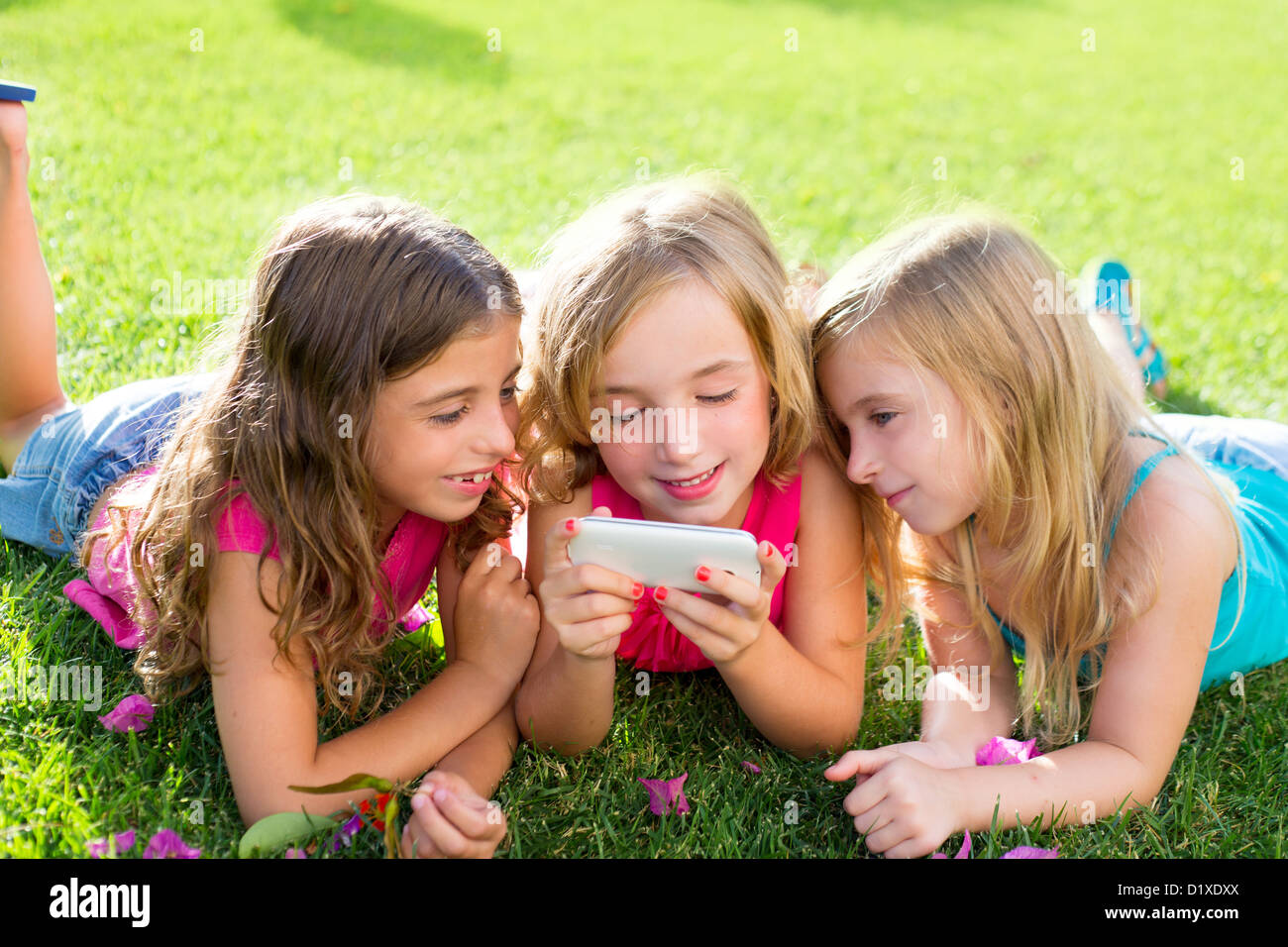 children friend girls group playing internet with mobile smartphone on ...