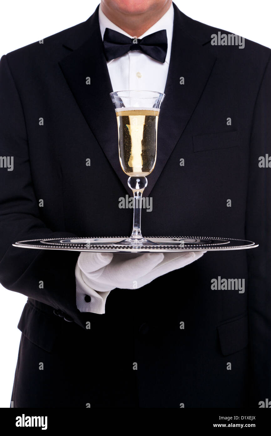 A butler serving a glass of champagne on a silver tray, on a white ...