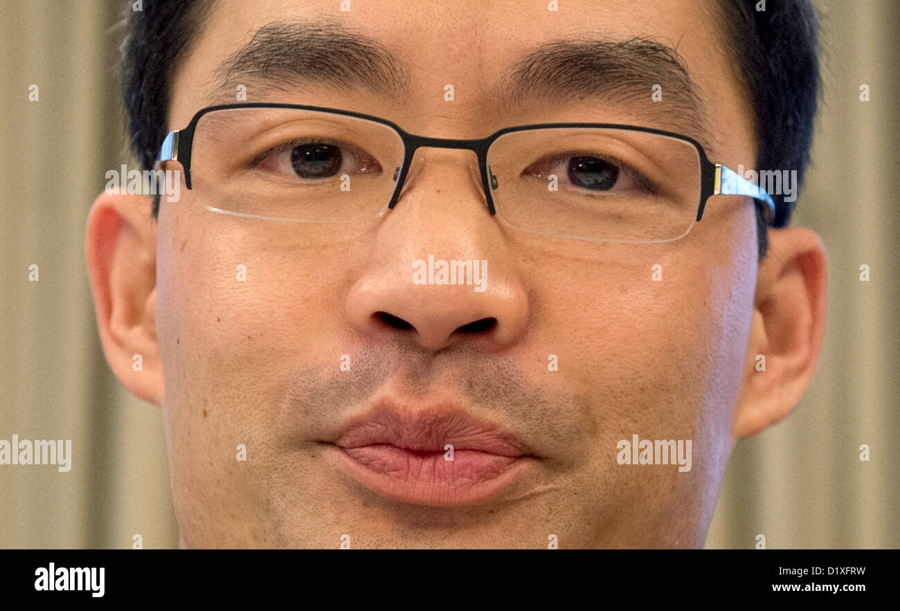 The chairman of the FDP, Philipp Roesler, smiles during a meeting of ...