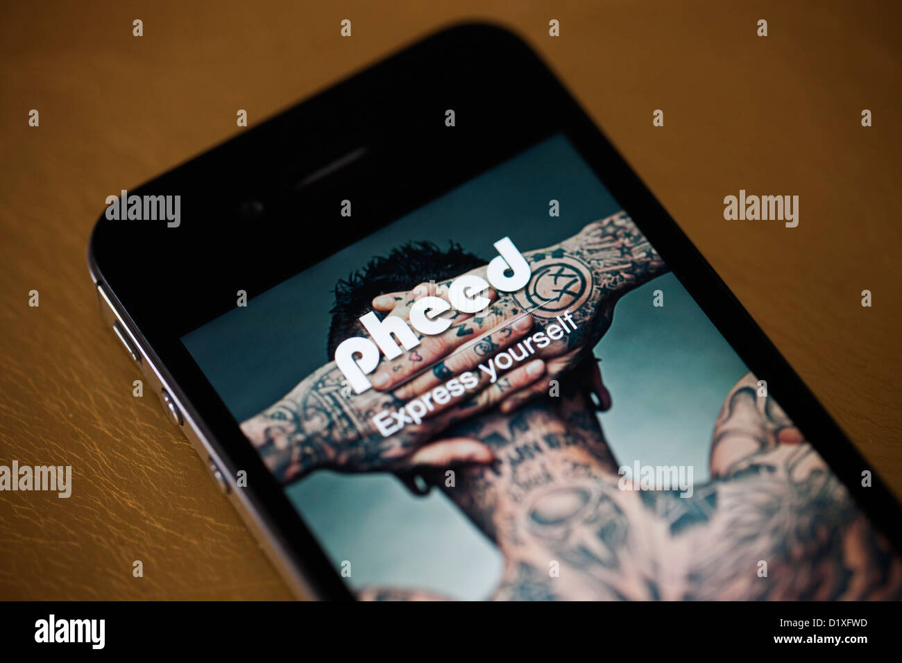 The homepage of the new social network Pheed is displayed on an iPhone ...