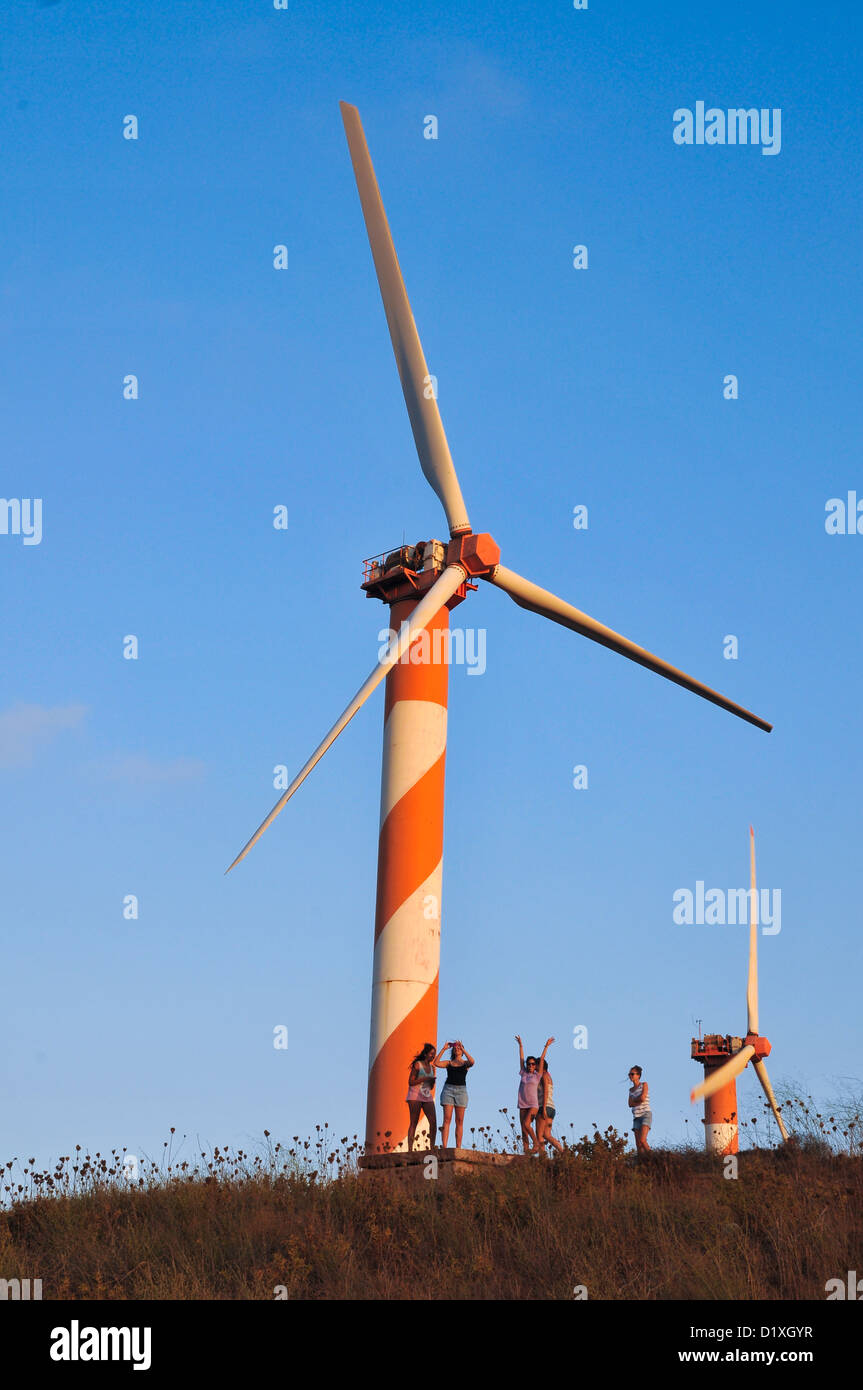 Excited young girls stand near Wind turbines. Photographed in Israel ...