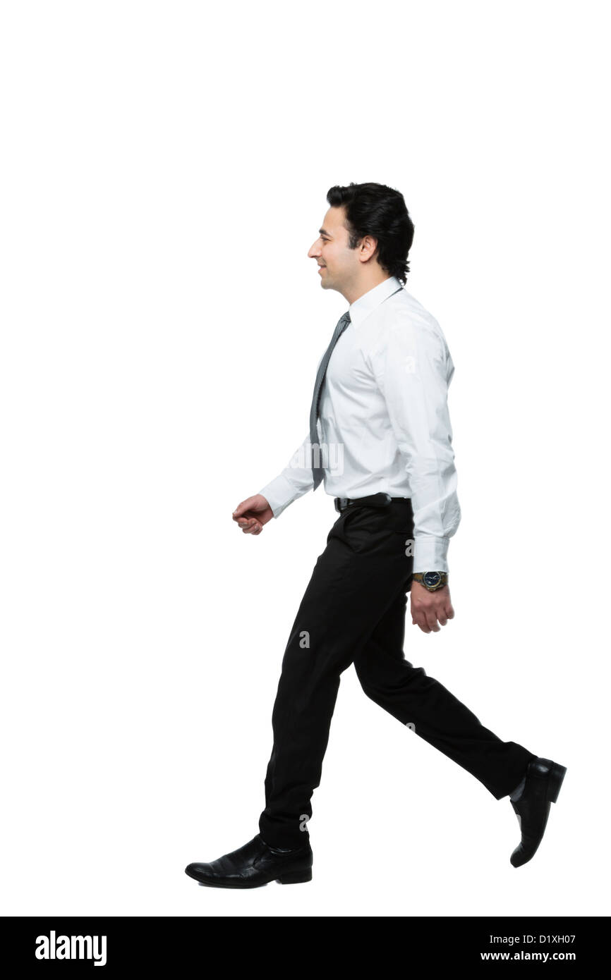 Indian man walking side view Cut Out Stock Images & Pictures - Alamy