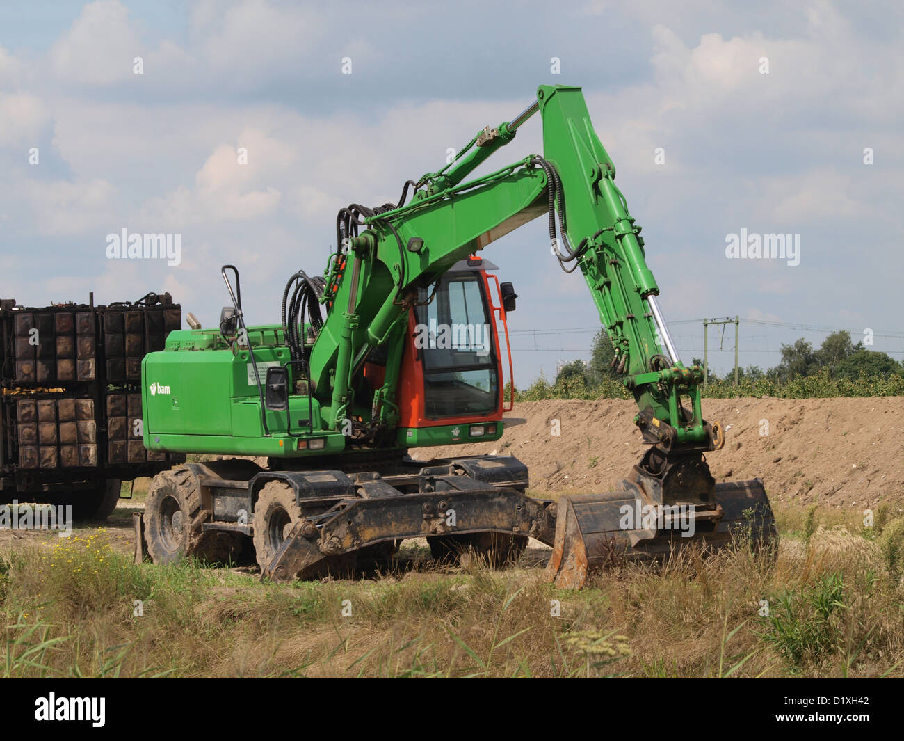 The Robex 170W-7 is a compact, versatile wheeled excavator used in ...