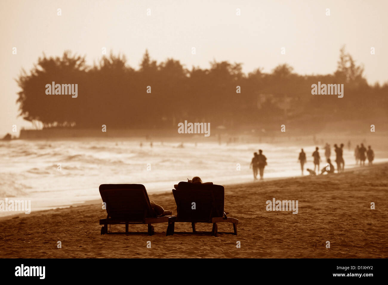 Inviting wooden chairs on a Mui Ne beach. Vietnam Stock Photo - Alamy
