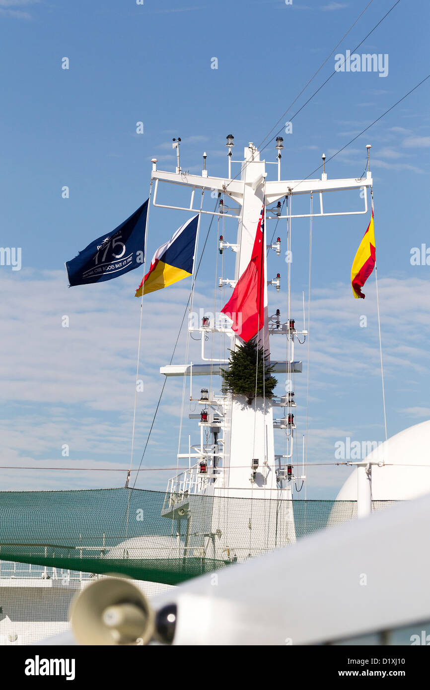 Flags flying from masthead Stock Photo - Alamy