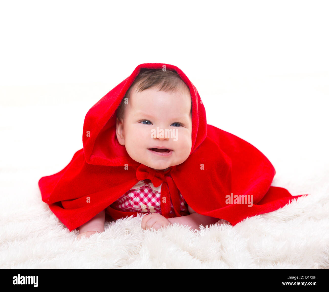 Baby Little Red Riding Hood on white fur with funny expression Stock ...