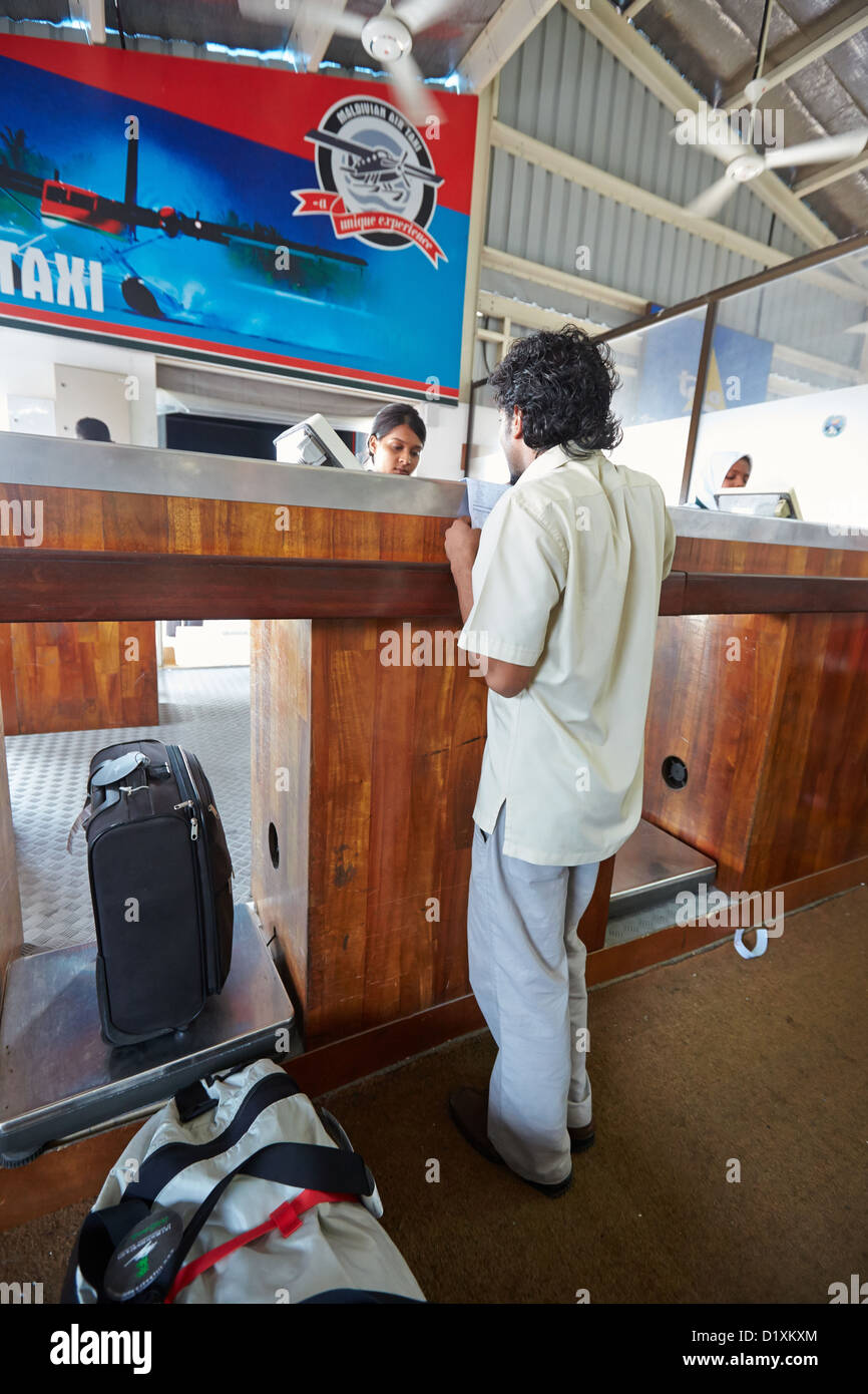 Maldivian Air Taxi sea plane check -in desk at Malé International ...