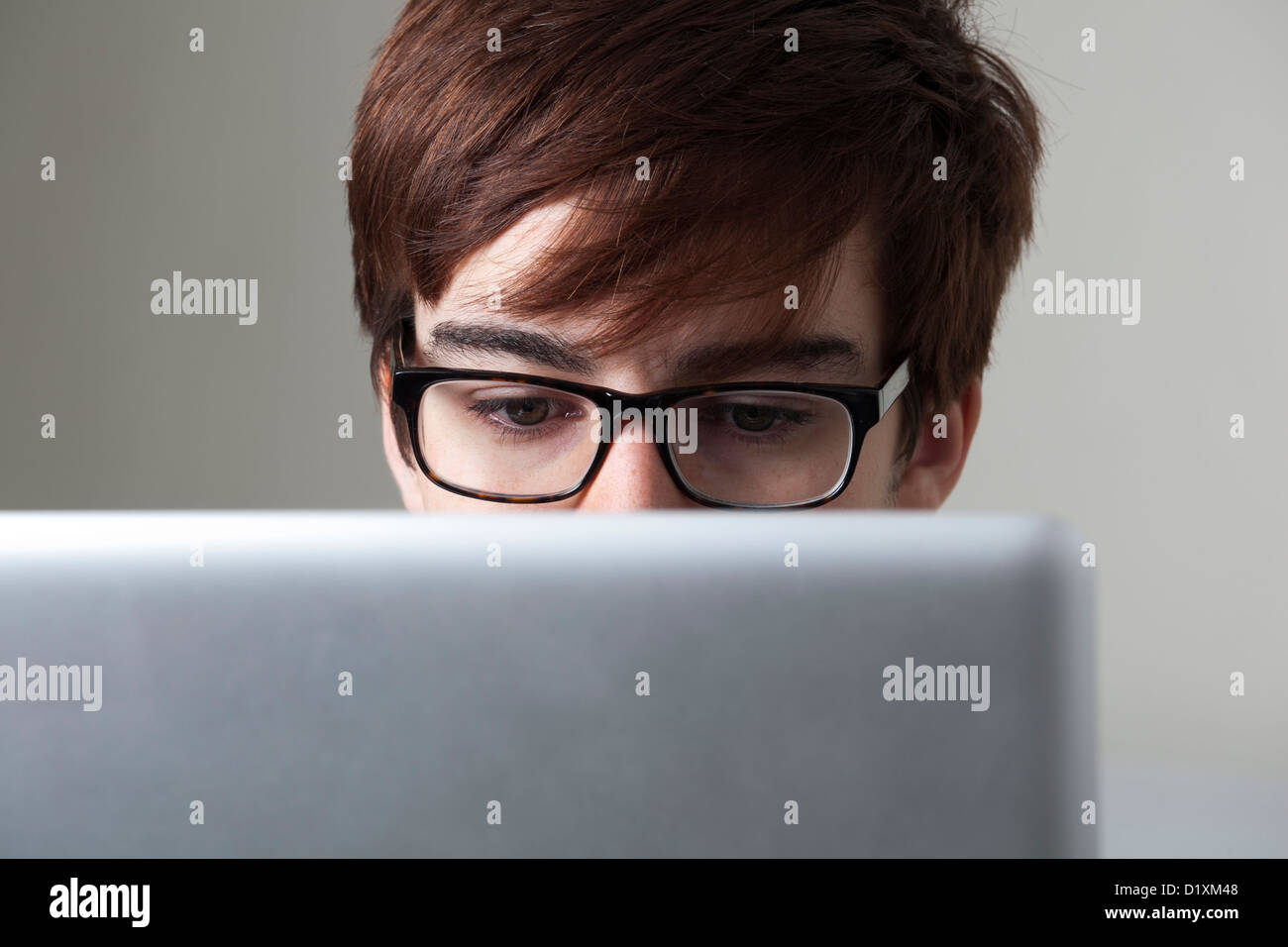 Man wearing glasses laptop hi-res stock photography and images - Alamy