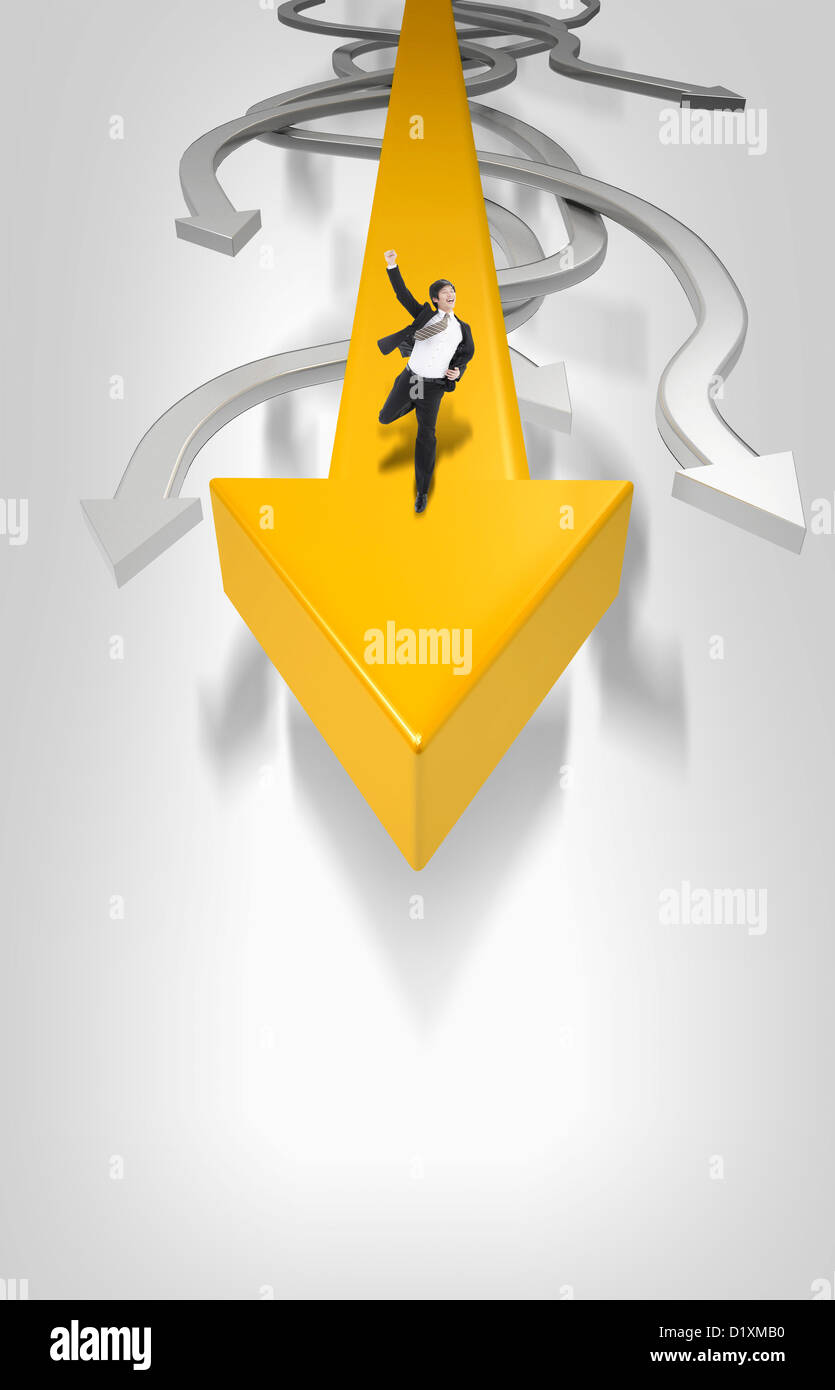 a businessman running on a yellow straight arrow Stock Photo - Alamy
