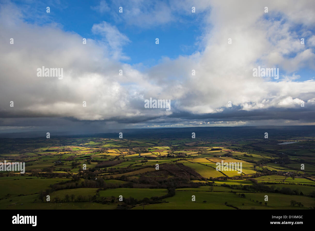 Fields partially lit by gaps in the clouds, seen from the Skirrid ...