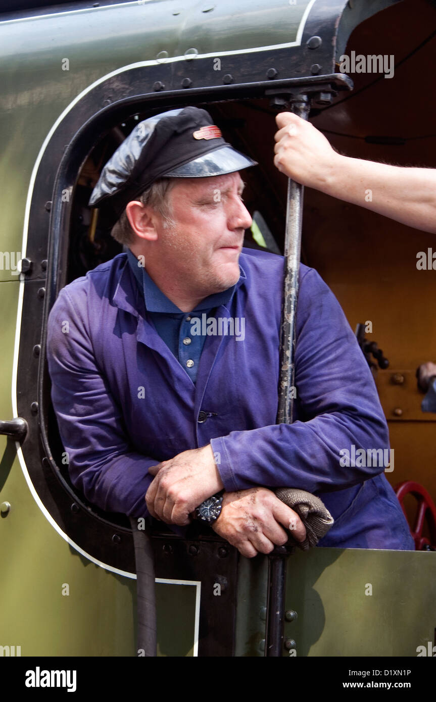 A steam engine driver in the cab of a locomotive Stock Photo - Alamy