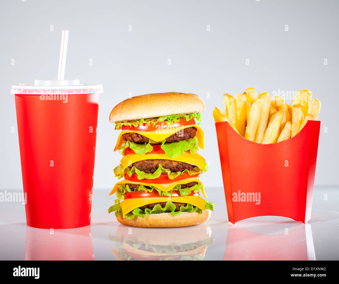 Tasty hamburger and french fries on a white background Stock Photo - Alamy