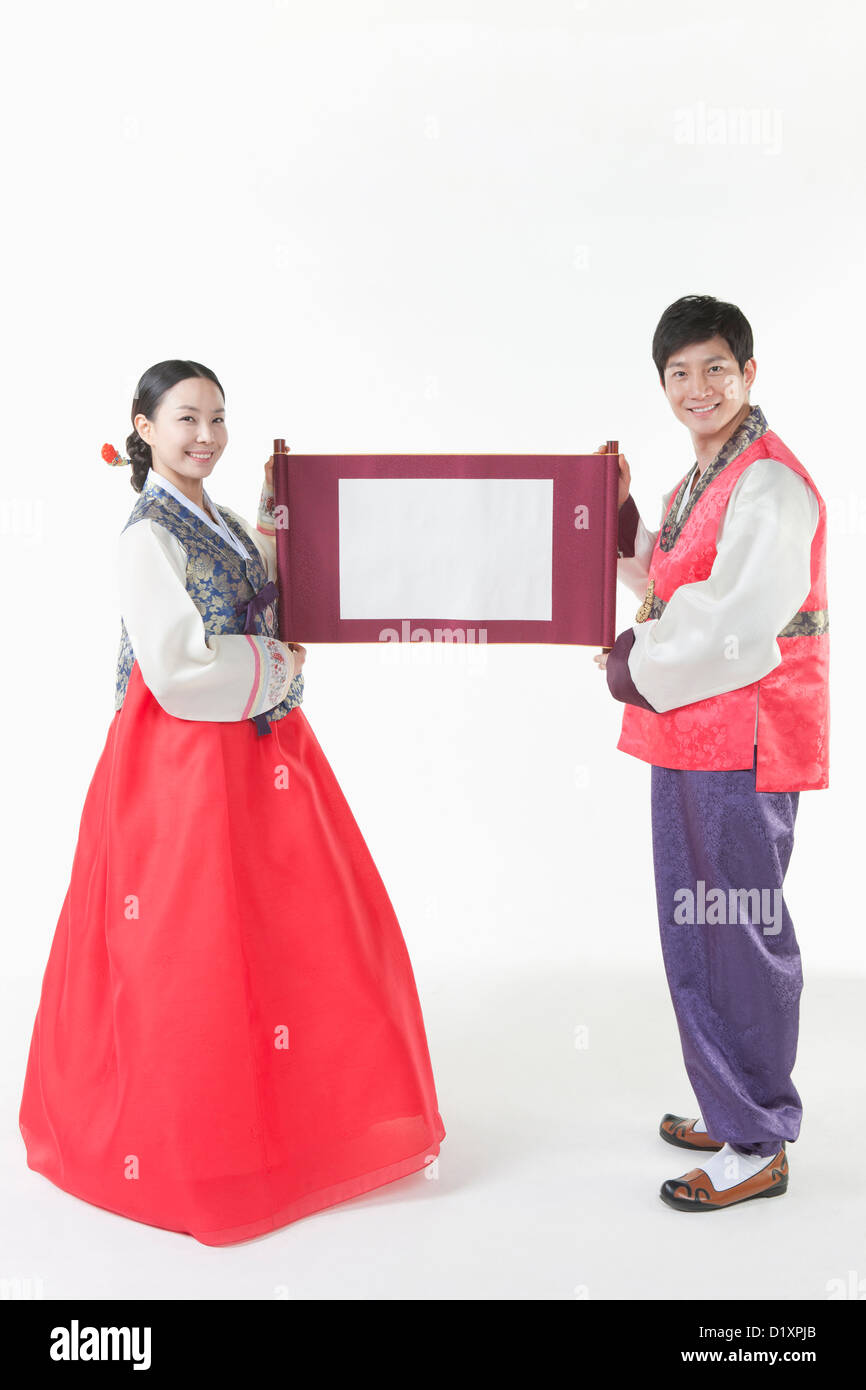 a couple in Hanbok holding Korean paper roll together Stock Photo - Alamy